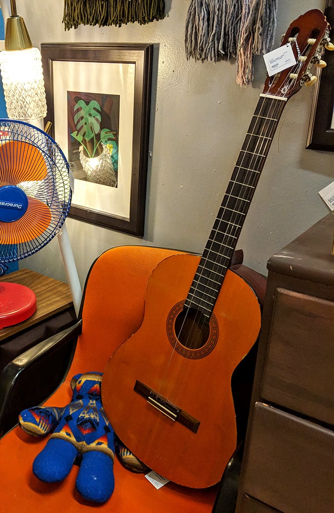 That orange guitar isn't just an instrument – it's the beginning of your living room's next great redesign story.