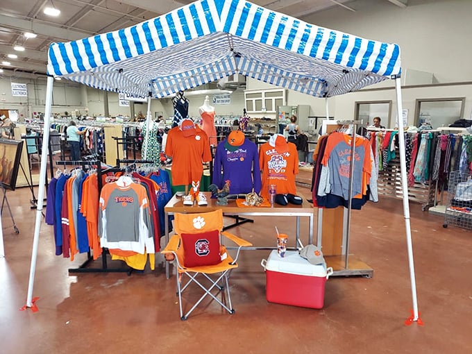 Clemson and Carolina fans can temporarily set aside their rivalries under this blue-and-white tent of collegiate gear – though the orange does seem to dominate.