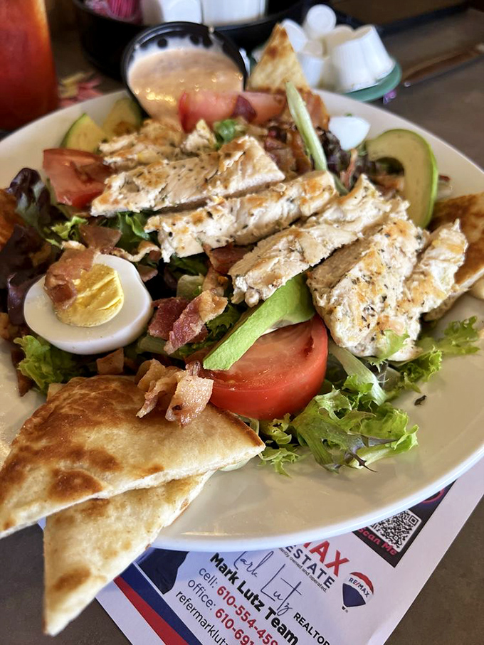 A salad that doesn't apologize for being hearty. Grilled chicken, fresh vegetables, egg, and avocado create a protein-packed masterpiece that makes eating greens feel indulgent.