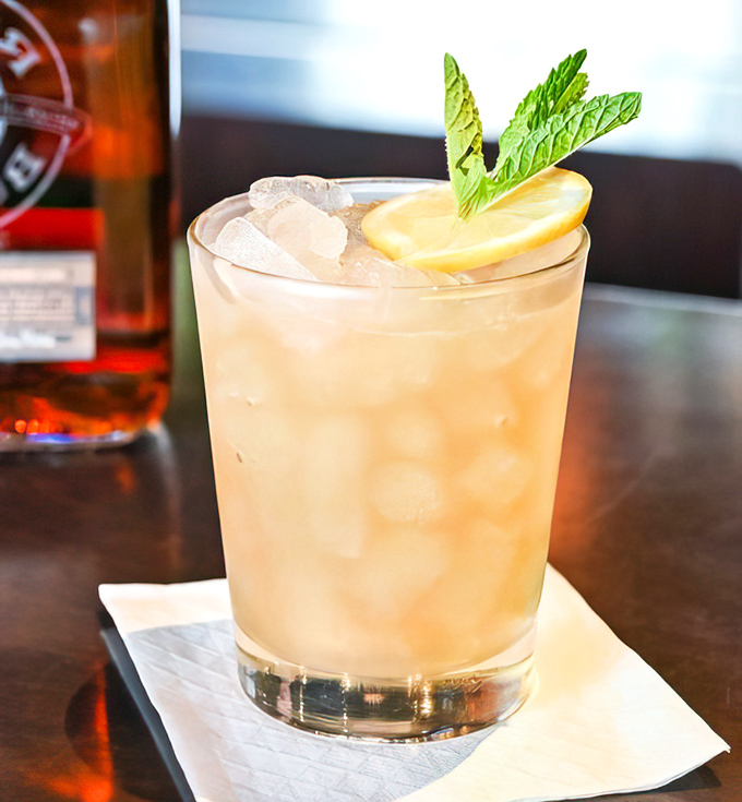 A cocktail that says "I'm sophisticated enough to appreciate good spirits but fun enough to enjoy a mint garnish" – summer in a glass.
