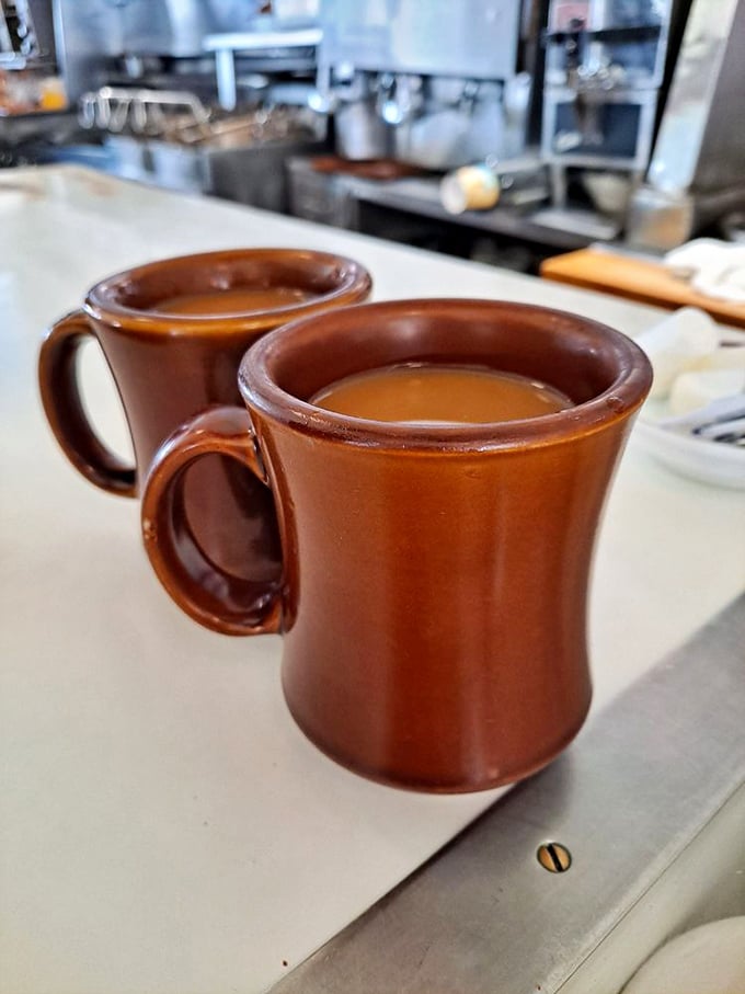 These aren't just coffee mugs—they're chalices of morning salvation, sturdy enough to withstand the apocalypse and deep enough to solve all problems.