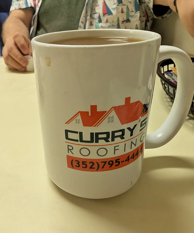 Even the coffee mugs tell stories here – where local businesses advertise and every refill comes with a side of community connection.