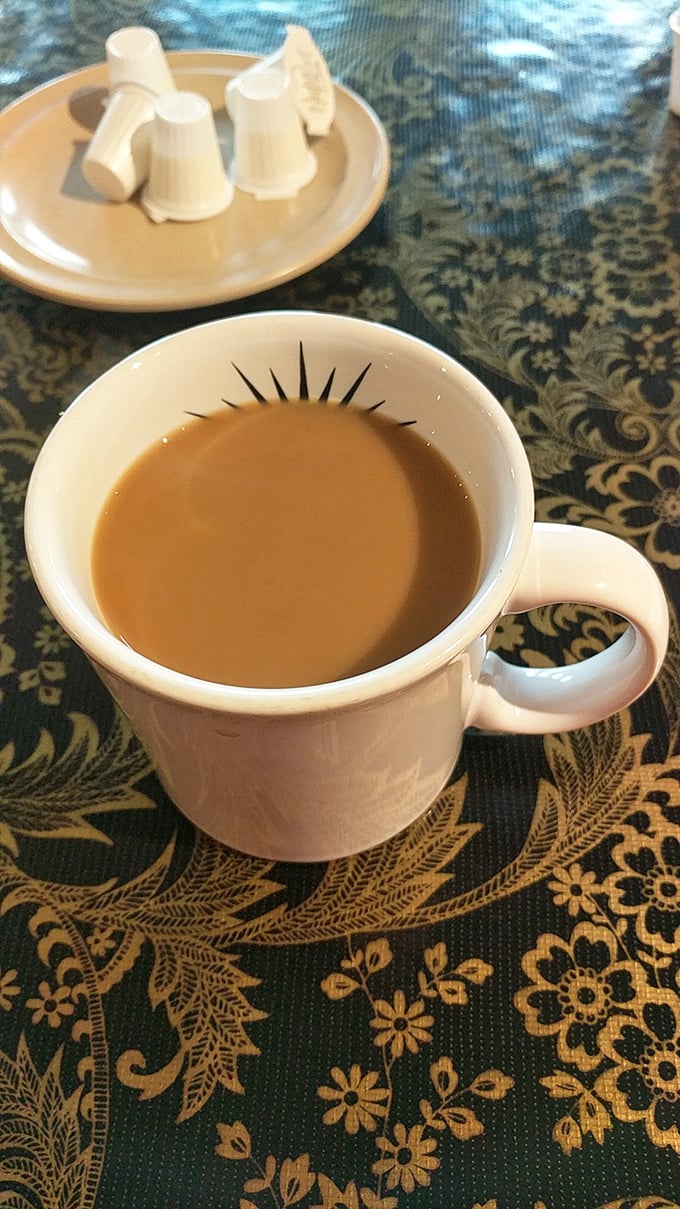 Coffee served in a proper mug with that sunrise logo – fuel for both body and soul.
