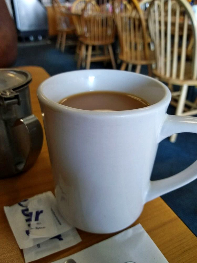 The humble diner mug—civilization's most perfect coffee delivery system. No fancy latte art needed when the coffee's this honest.