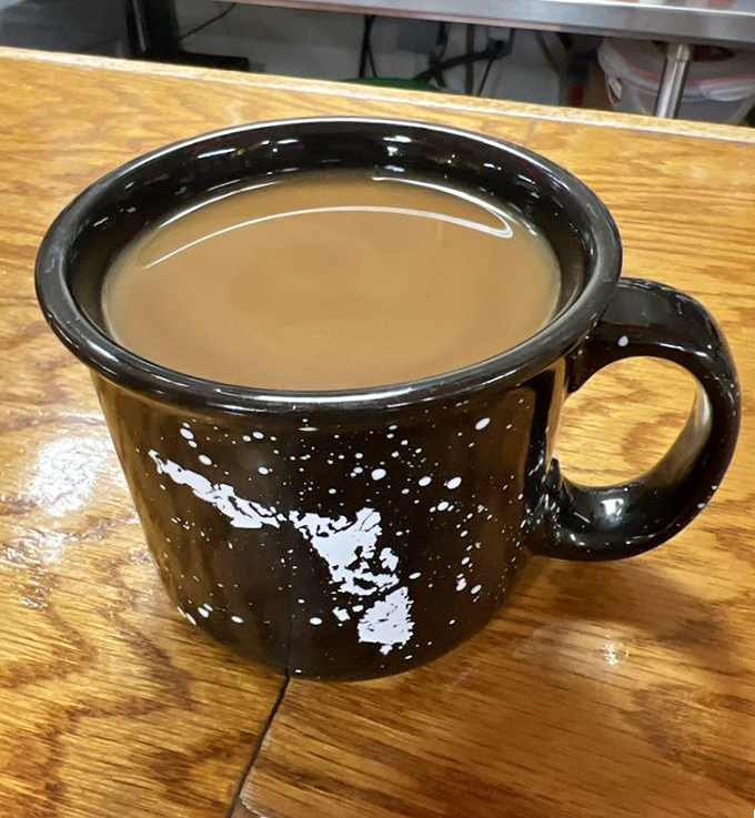 The humble coffee mug—speckled like a quail's egg and filled with the liquid motivation that powers Florida's entire breakfast economy.