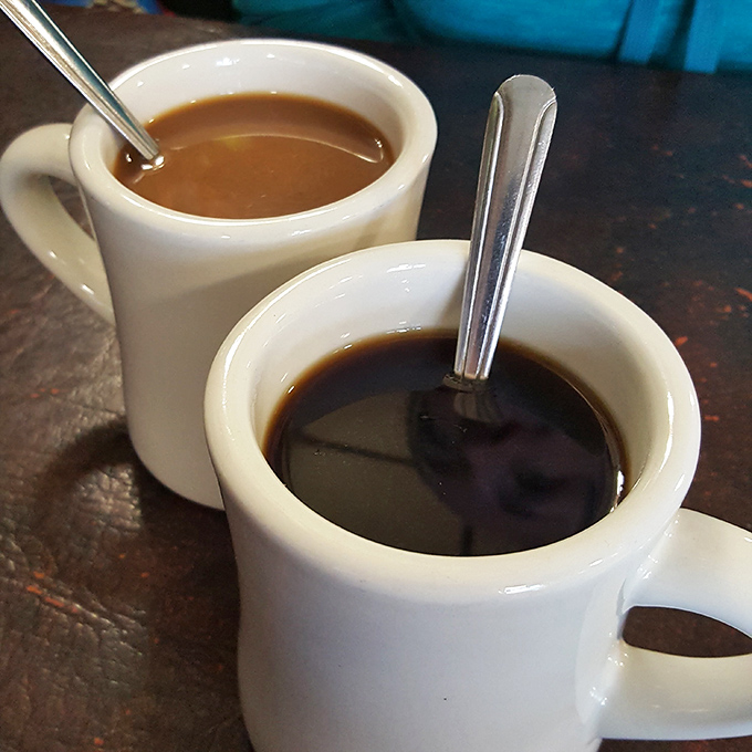 Diner coffee in those thick white mugs—not fancy, not pretentious, just honest brew that knows its job is to wake you up.
