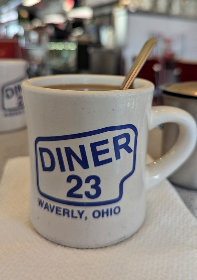 That iconic white mug says it all—straightforward diner coffee that keeps coming until you surrender. No fancy foam art needed.
