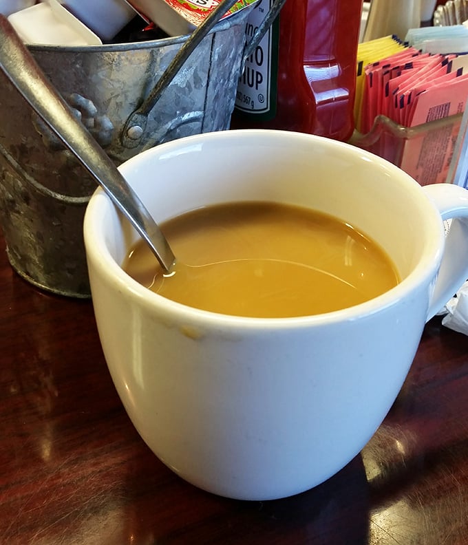 Coffee served in a simple white mug—proof that sometimes the most profound pleasures come in the most humble vessels.