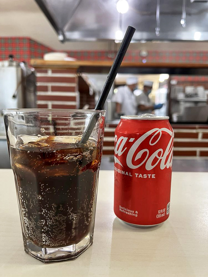 The classic pairing: ice-cold Coca-Cola served alongside burgers. Some traditions don't need improving—they just need preserving.