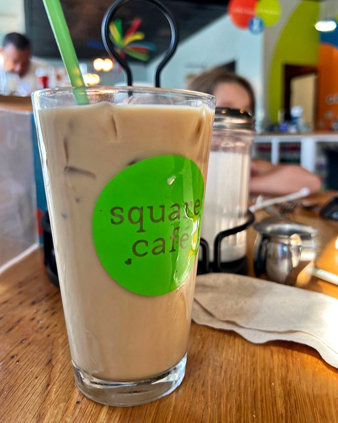 Coffee that doesn't just wake you up but makes you glad you're awake, served in a glass that proudly announces its Square Cafe origins.