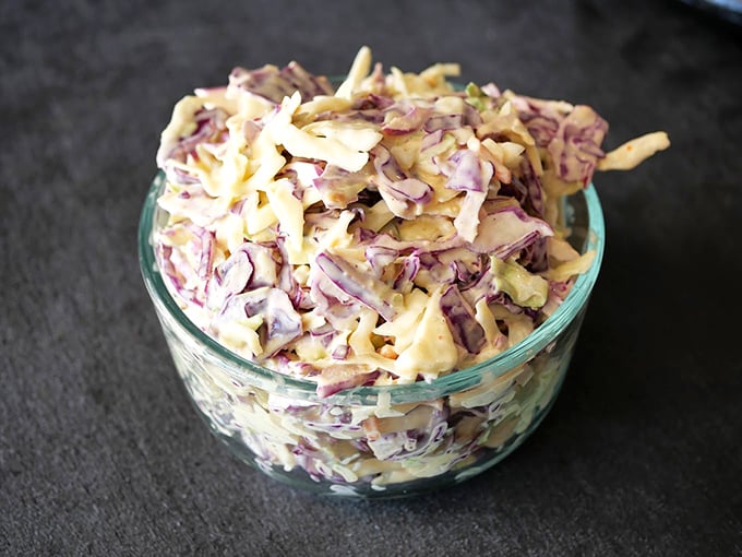Coleslaw that actually deserves a place at the barbecue table—crisp, colorful, and not drowning in a pool of mayonnaise mediocrity.