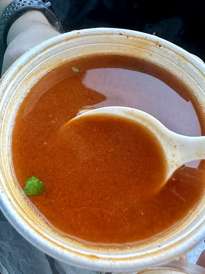 Liquid gold: The consommé offers rich, savory depth that could make a vegetarian question their life choices. One spoonful tells a complete story.