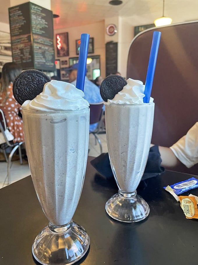 Cookies and cream milkshakes topped with Oreos—proof that sometimes the best adult beverages don't need alcohol, just a sturdy straw and patience.