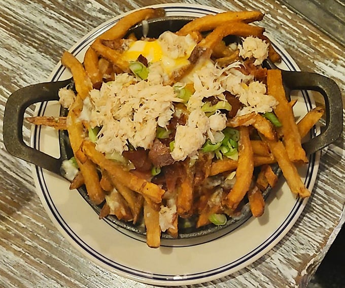 Loaded crab fries—because regular fries weren't indulgent enough. The ultimate Baltimore comfort food that demands to be shared.