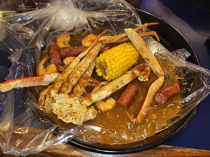 This seafood boil bag isn't just dinner, it's an event – crab legs reaching skyward like they're celebrating their delicious destiny.