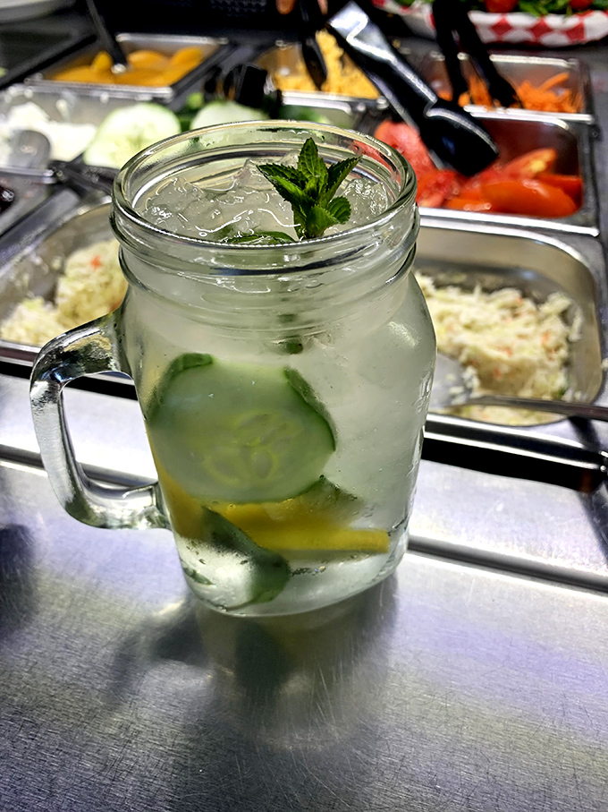 Not just a drink, but a summer vacation in a mason jar. Cucumber, lemon, and mint—the holy trinity of refreshment.