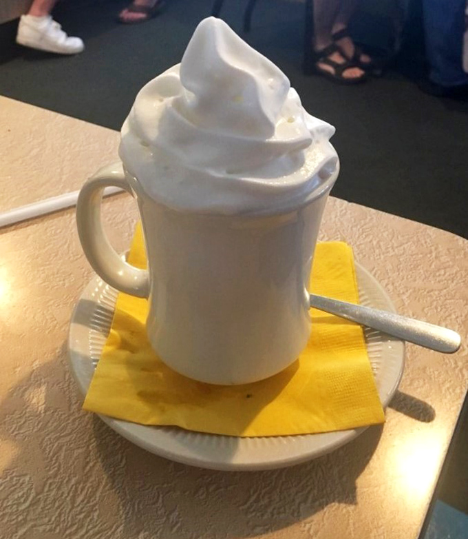 That's not just coffee – it's a cloud-topped mug of comfort that makes waiting for your breakfast feel like the best part of your day.