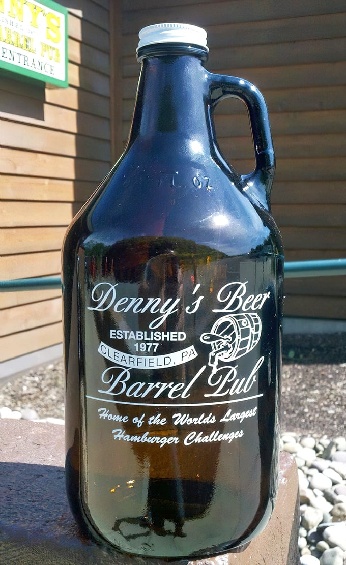 The signature growler—not just a vessel for beer, but a souvenir of survival after facing down Pennsylvania's most formidable burgers.