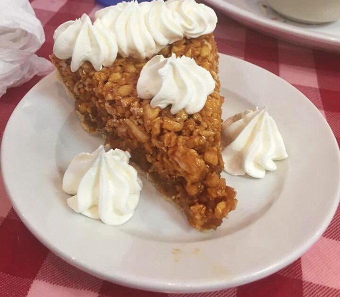This isn't just peanut pie—it's Virginia's answer to pecan pie, topped with clouds of whipped cream that make every bite a celebration.