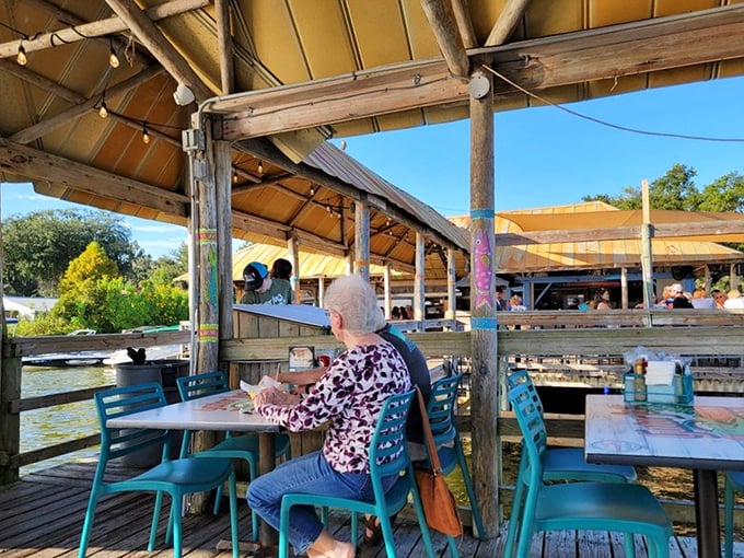 Dining with a water view that doesn't cost extra. The deck extends over Lake Weir, offering tables where the scenery rivals what's on your plate.