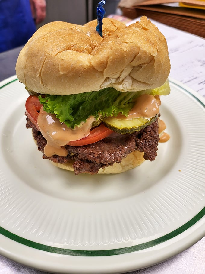 This isn't just a burger—it's a statement. Half-pound of local beef dressed with enough toppings to require jaw exercises beforehand. 