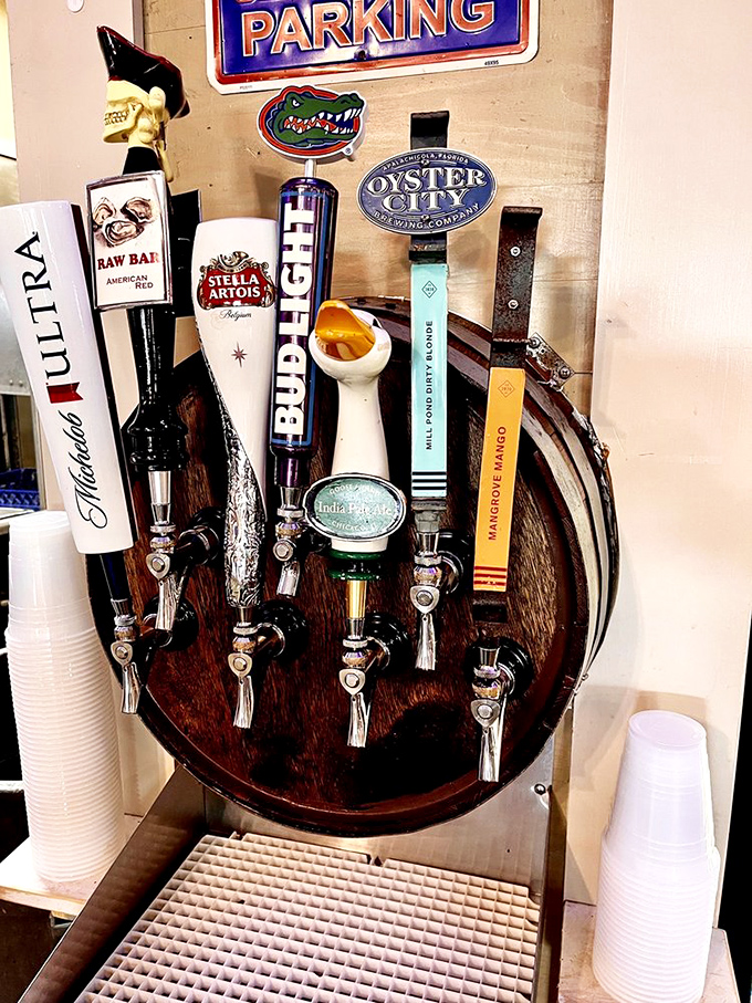 The beer tap setup looks like a shrine to good times, with Florida Gator pride prominently displayed. Hydration is important when eating seafood!