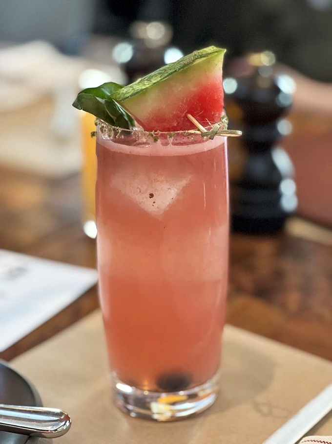 This isn't just a cocktail—it's summer captured in a glass, wearing a watermelon hat. The kind of drink that makes you forget about your emails while remembering what vacation feels like.
