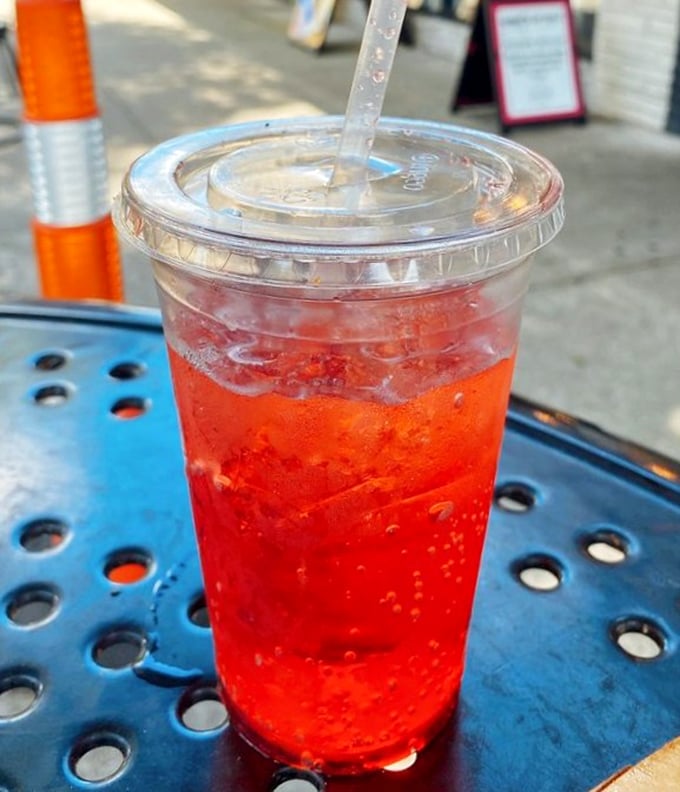 A refreshing red soda in the Florida sunshine – because every great hot dog deserves an equally impressive beverage companion.