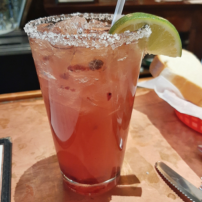 This isn't just a cocktail—it's desert refreshment in a glass, with that salt rim and lime wedge promising to make the Arizona heat a distant memory.