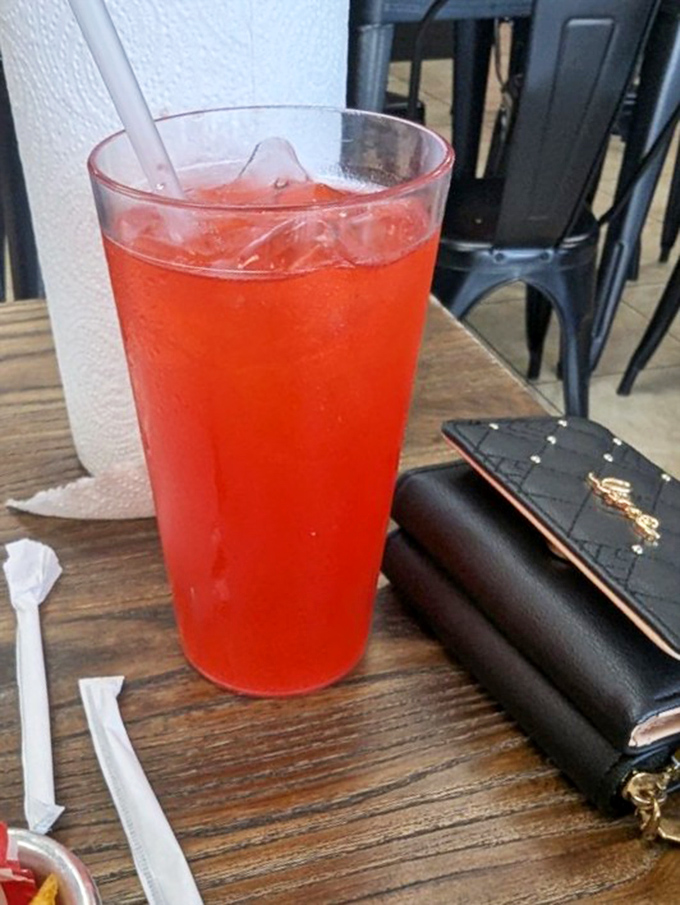 That vibrant red punch isn't just a drink—it's sweet, cold salvation after committing to the spicier BBQ sauce options.