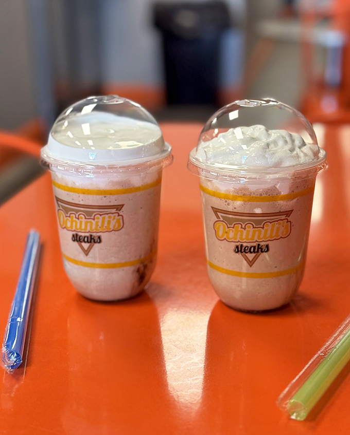 Branded milkshake cups promise thick, creamy indulgence – the perfect sweet companion to any savory Ochinilis creation.