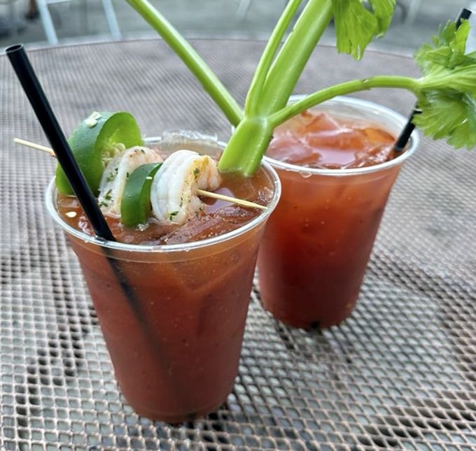 Bloody Marys garnished with shrimp and celery stalks—because sometimes your cocktail should double as an appetizer.