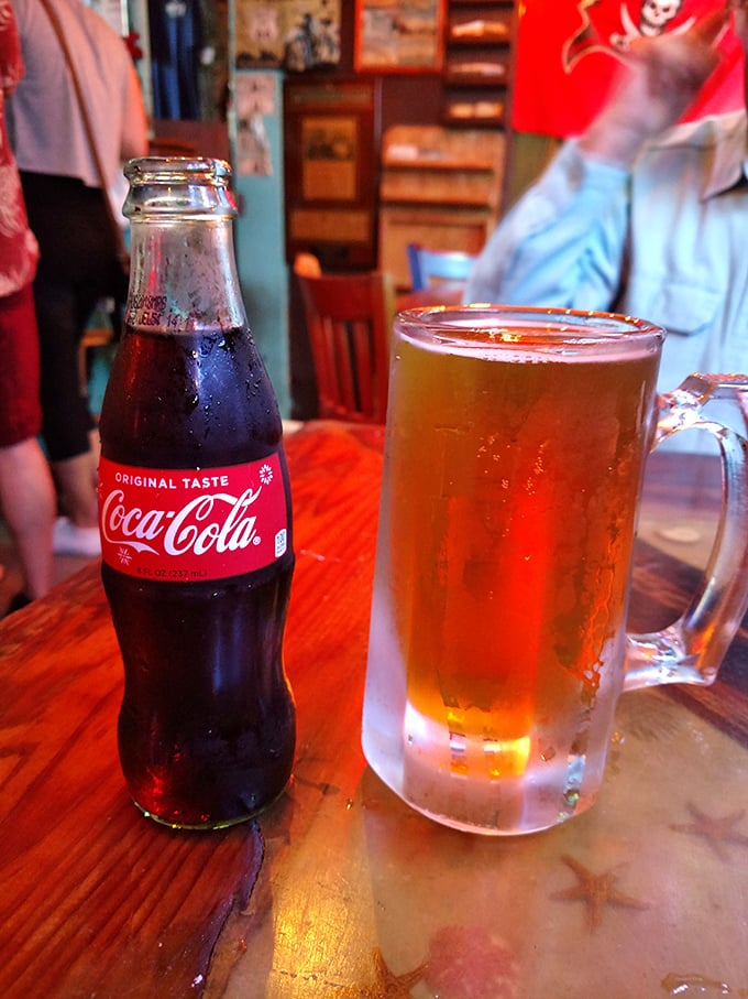 Cold Coca-Cola meets frosty beer mug—a pairing as timeless as Florida sunshine and afternoon thunderstorms.