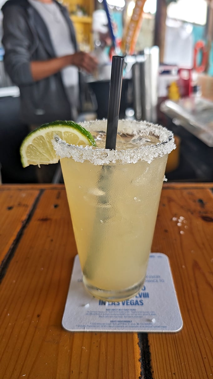 A salt-rimmed margarita that tastes like permission to start your weekend early, regardless of what day it actually is.