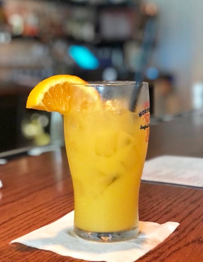 This sunshine-in-a-glass orange cocktail doesn't just complement seafood—it transports you straight to vacation mode with one sip.