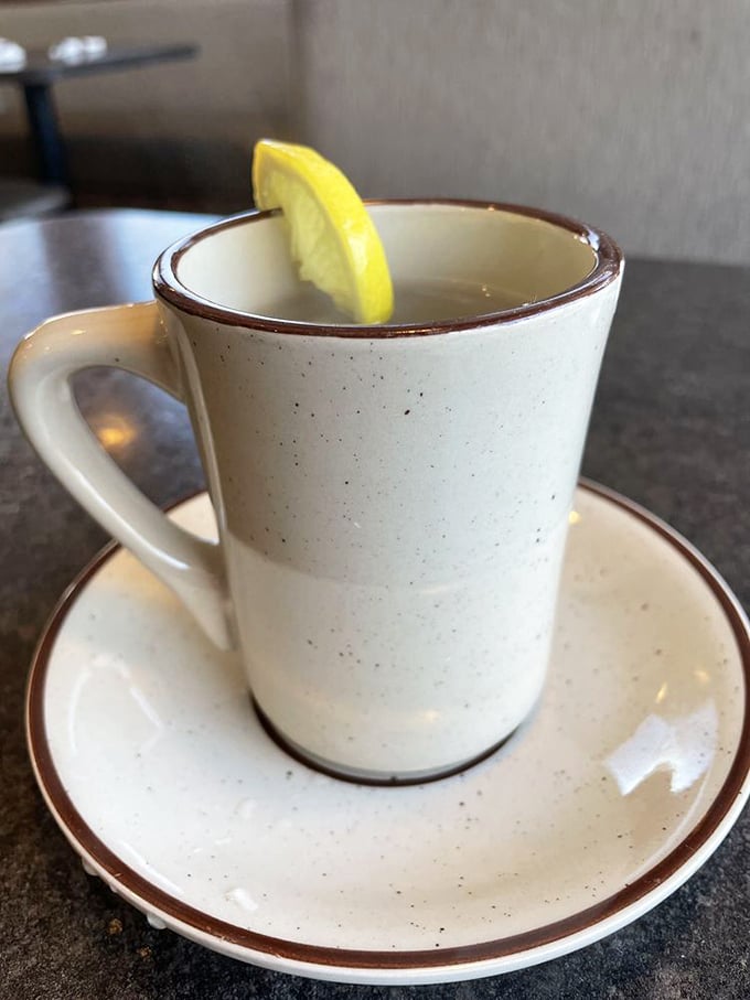 That classic diner mug with a lemon wedge—because sometimes hot tea in a sturdy cup is all the luxury you need.