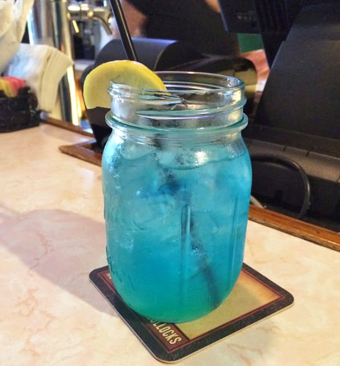 Electric blue lemonade in a mason jar—because sometimes you need something fun to wash down all that serious barbecue. The lemon slice adds a touch of citrus sunshine.