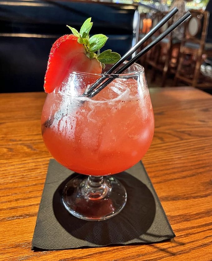 This isn't just a cocktail—it's summer in a glass. Garnished with fresh strawberry and mint, it's the kind of drink that demands a sunset view.