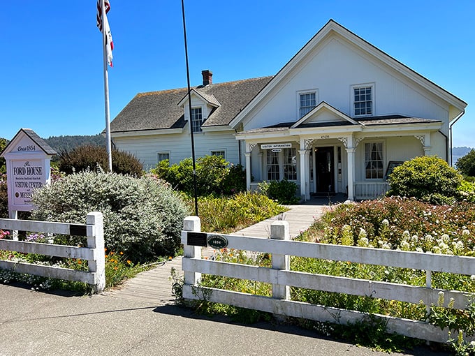 The Ford House Museum welcomes visitors with classic white picket charm, a gateway to understanding Mendocino's fascinating lumber town origins.