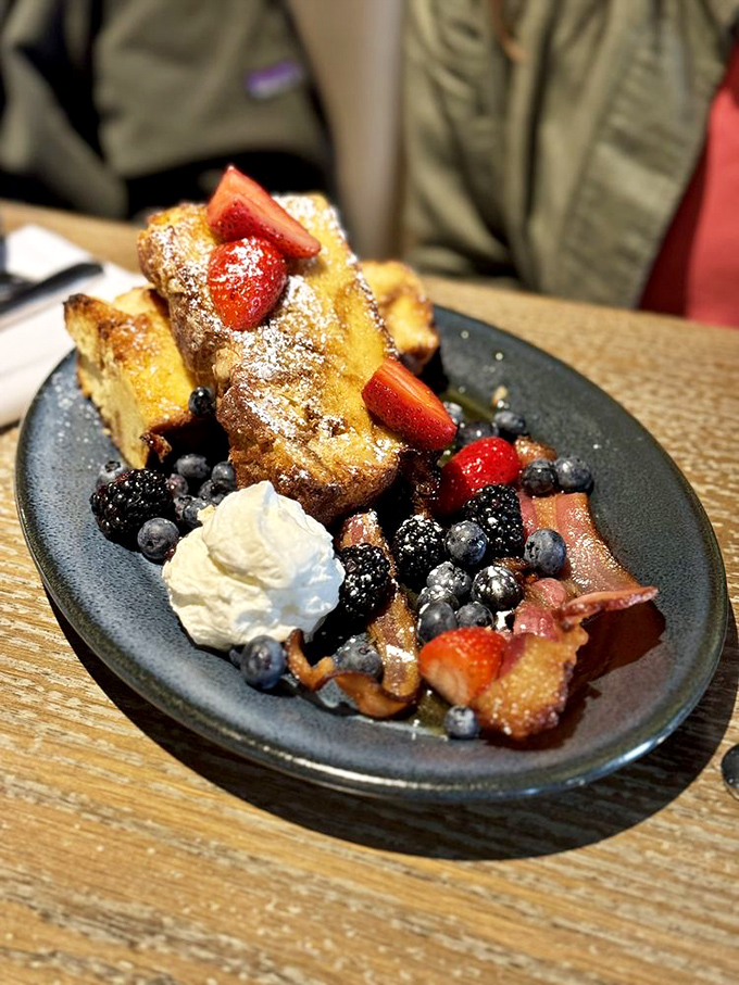 French toast that makes breakfast feel like dessert, surrounded by nature's candy. Berry-crowned royalty on a plate.