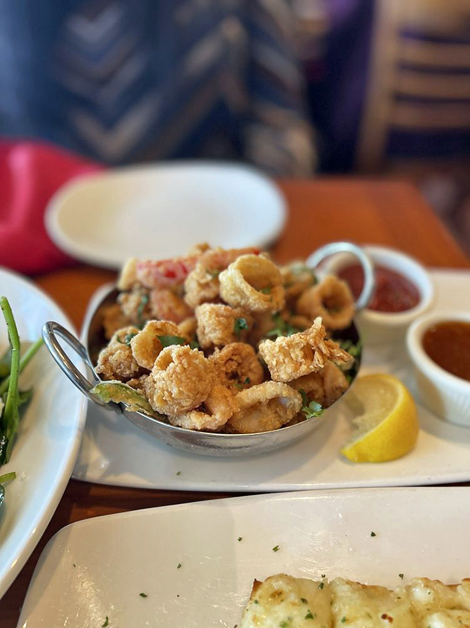 Golden-fried calamari that passes the ultimate test – it doesn't need the sauce, but you'll want it anyway.
