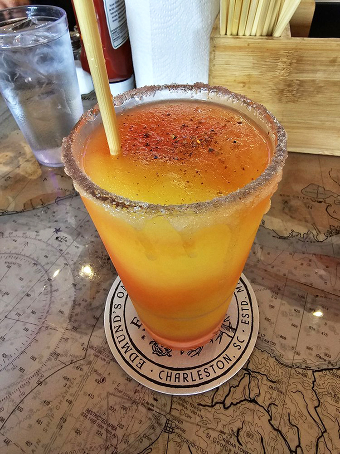 Not just a drink—it's a sunset in a glass. This spicy-rimmed concoction sits atop a map, plotting your course to relaxation.