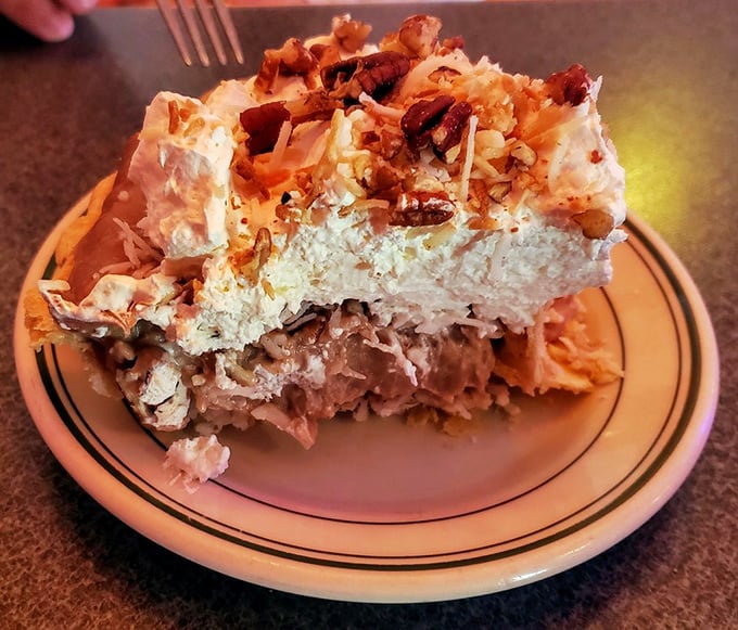 
This isn't just dessert—it's an engineering marvel. Layers of chocolate, coconut, and cream create a sweet symphony that makes you wonder why anyone bothers with plain old chocolate cake. 