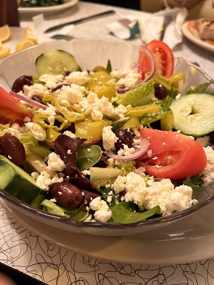 A Greek salad bursting with color and freshness—proof that sometimes the simplest combinations create the most spectacular results, like The Beatles or peanut butter and jelly.
