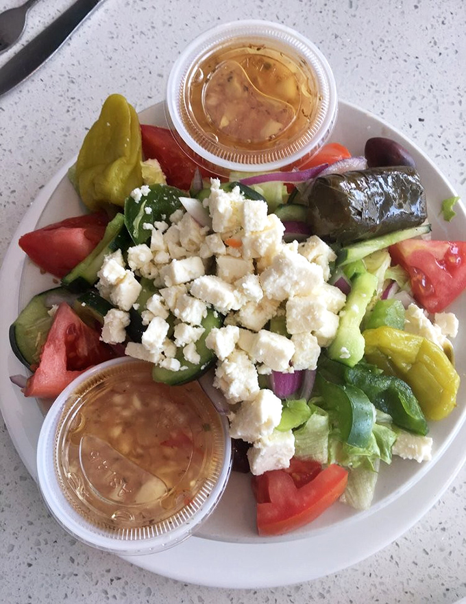 This Greek salad isn't just fresh—it's a Mediterranean vacation without the airfare. The feta cheese crumbles are generous enough to make Zeus himself nod in approval.