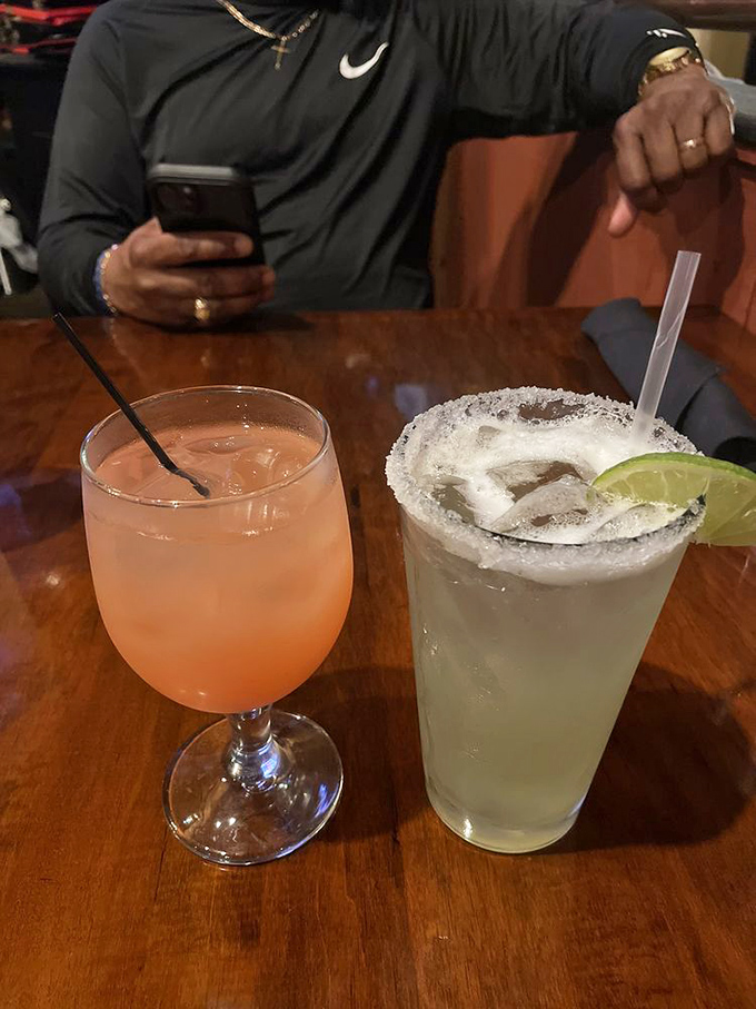 Vacation officially begins when the bartender slides these across the bar—a salt-rimmed margarita and something pink that promises good decisions.