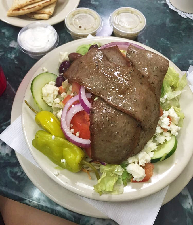 A Greek salad that would make Zeus himself descend from Mount Olympus. Fresh, vibrant, and topped with gyro meat that's divine intervention.