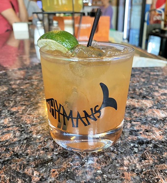 A refreshing cocktail in Hyman's signature glass—because sometimes the perfect seafood companion comes in liquid form.