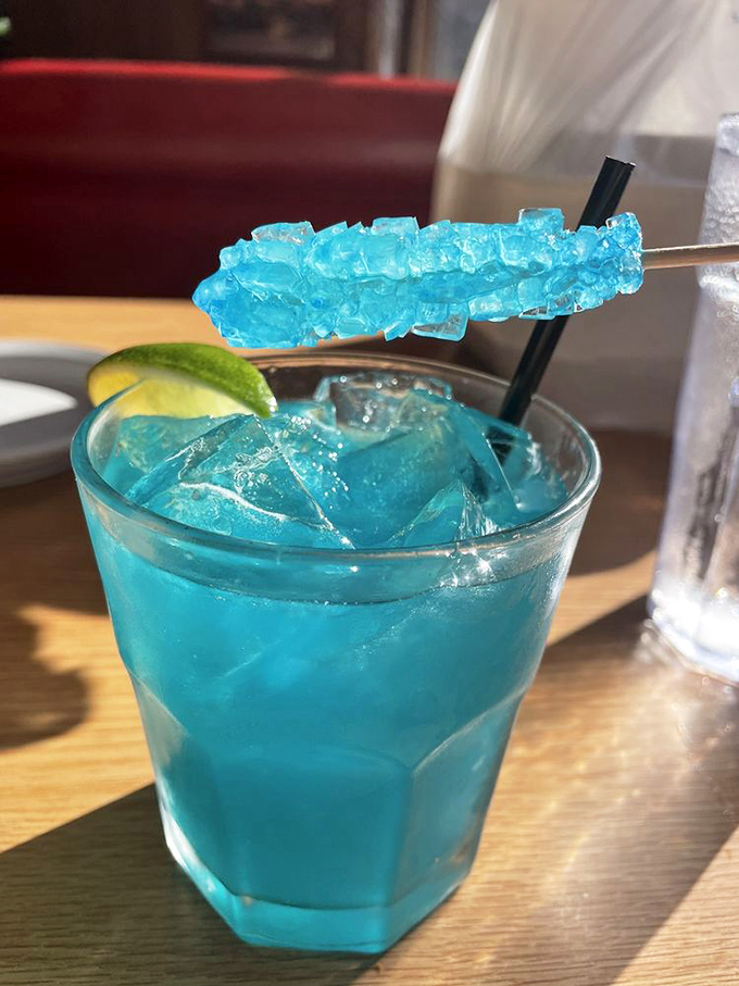 This electric blue concoction isn't just a drink—it's a vacation in a glass, complete with rock candy that doubles as a stirrer.