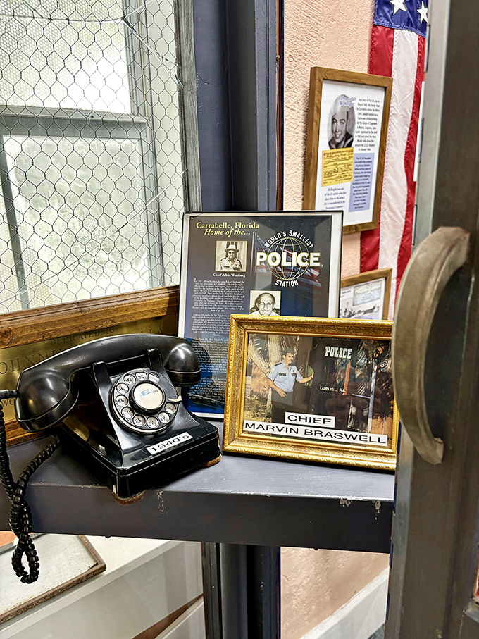 Vintage rotary phone and police memorabilia create a nostalgic law enforcement time capsule experience.